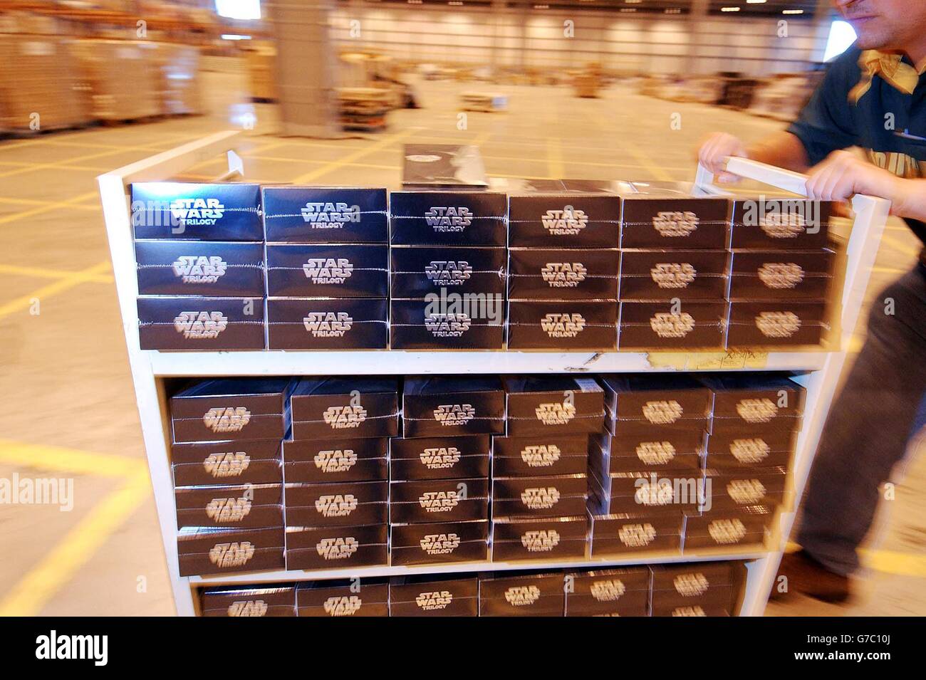 Staff at Amazon.co.uk pack the new Star Wars Trilogy DVD box set, which ...