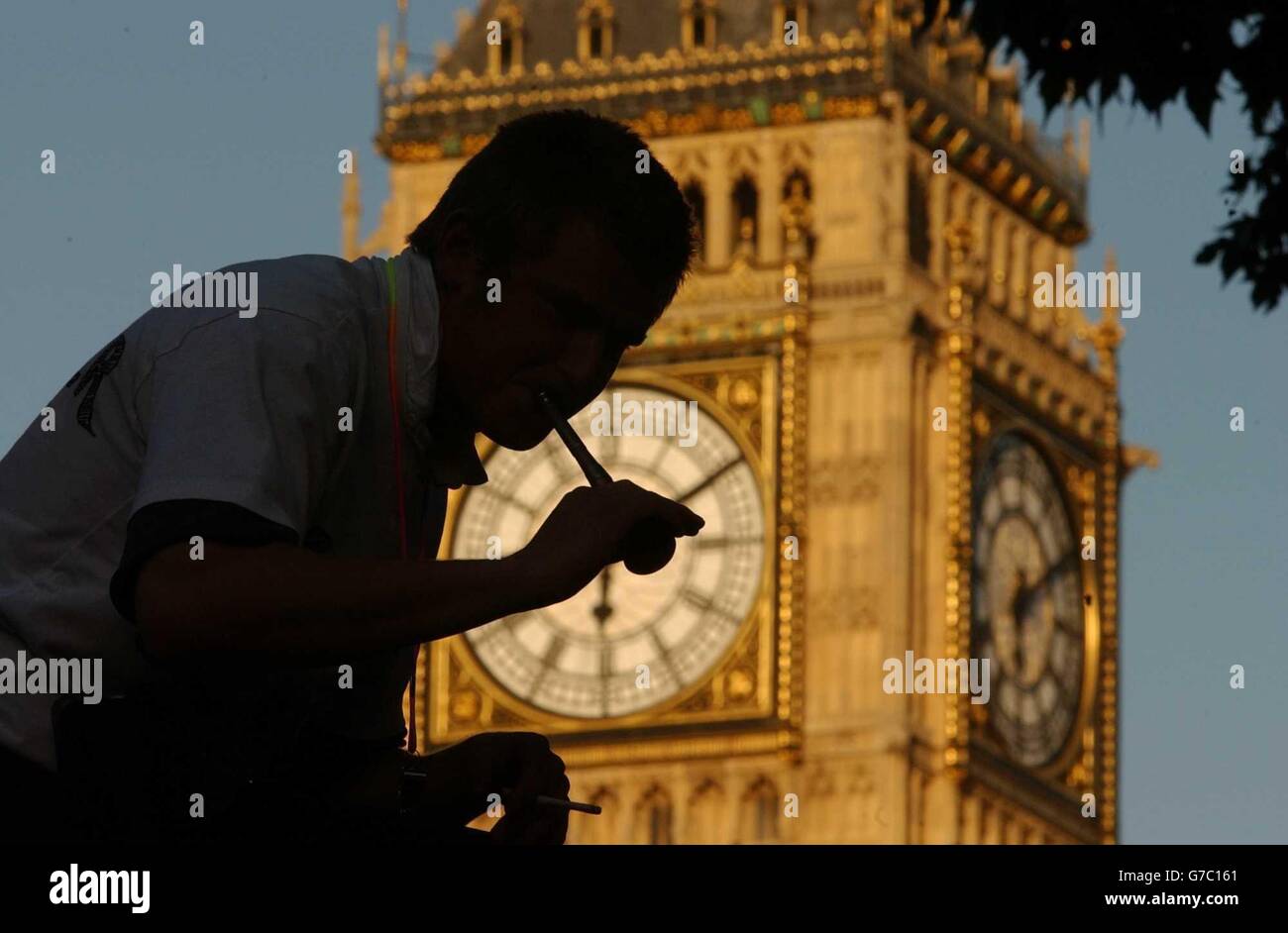 A protestor blows a hunting horn against the back-drop of Big Ben as he ...