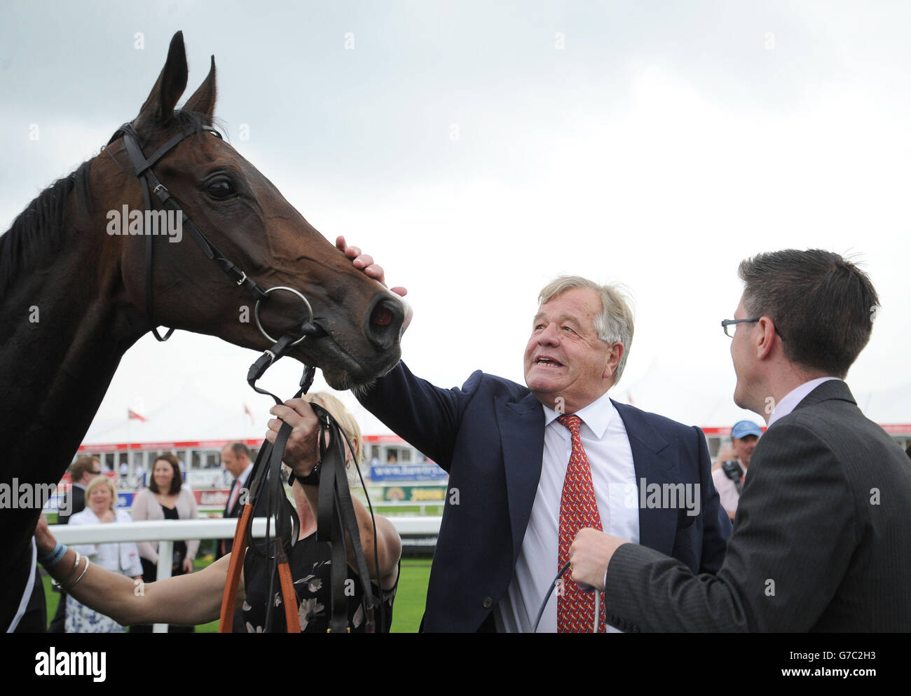 Trainer Sir Michael Stoute congratulates Estimate after winning the ...