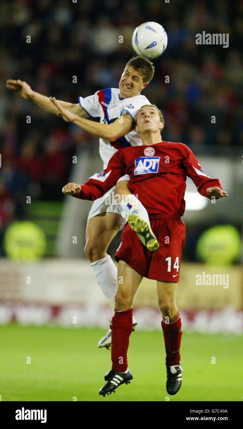 Rangers' Gregory Vignal (left) heads the ball up against Aberdeen's ...