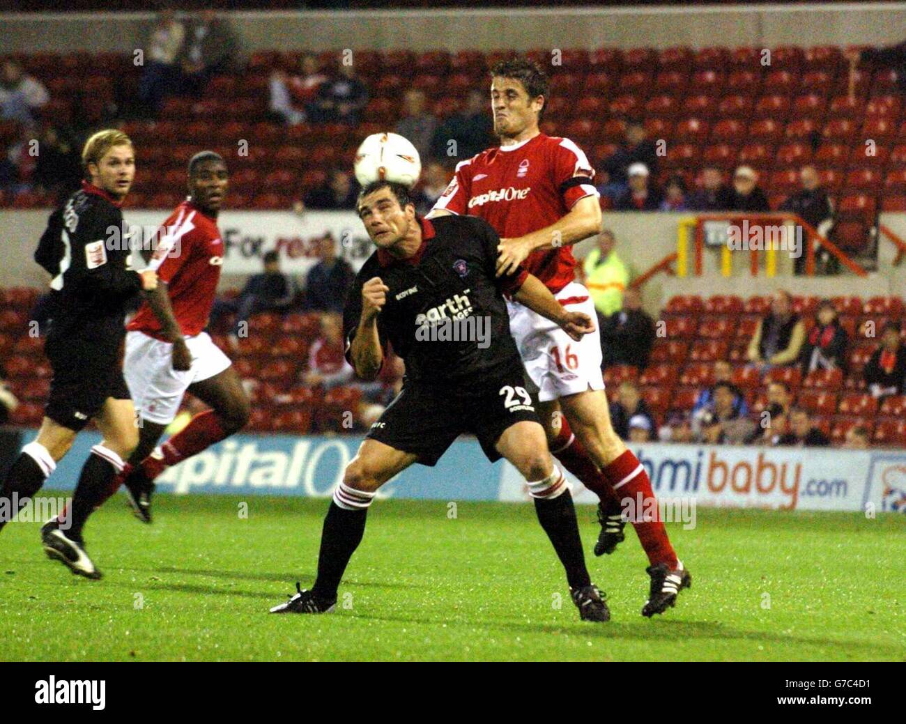Forest's Chris Doig (right) and Rotherham's Richie Barke contest the ...