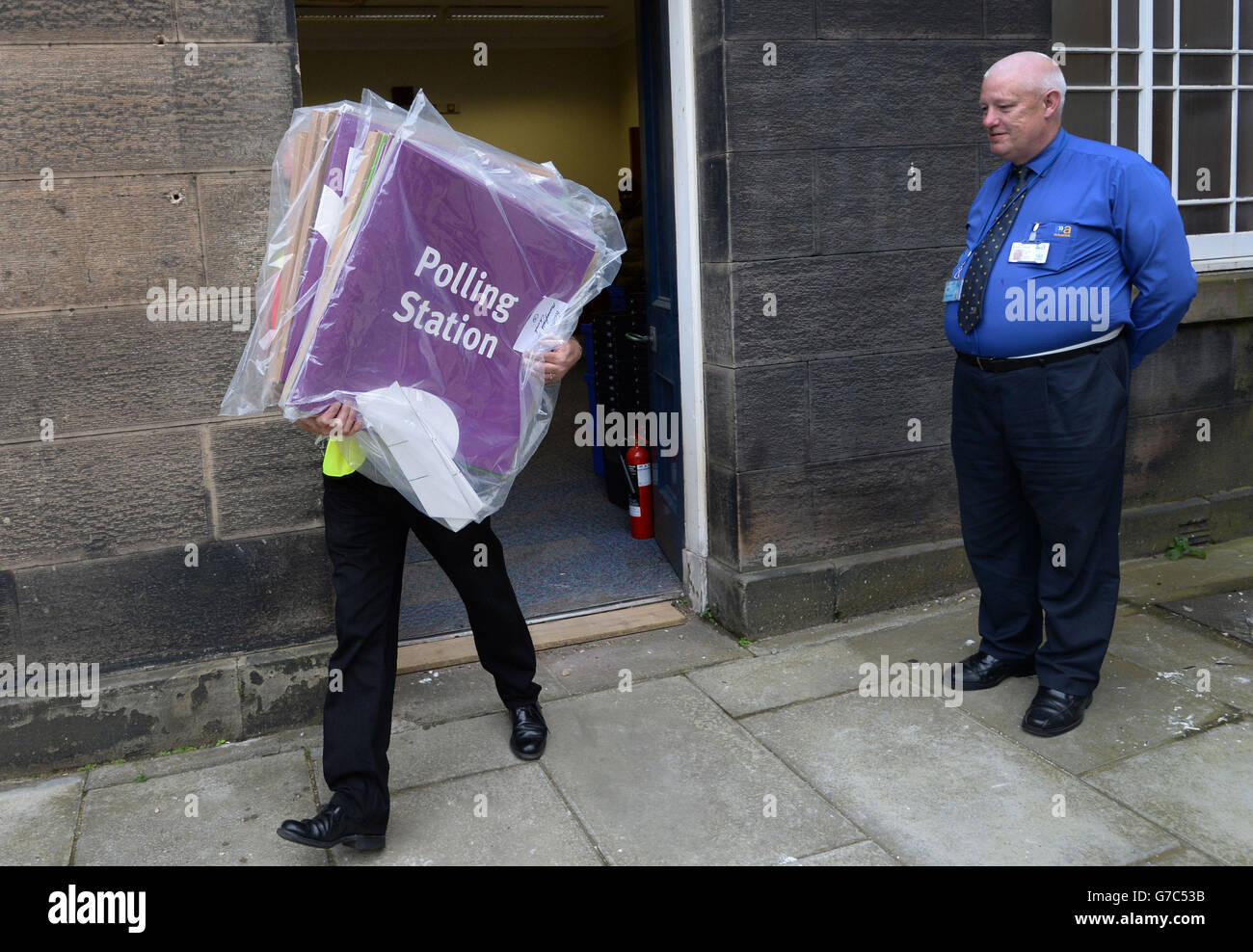 Ballot boxes and polling station signs are loaded into vans in ...