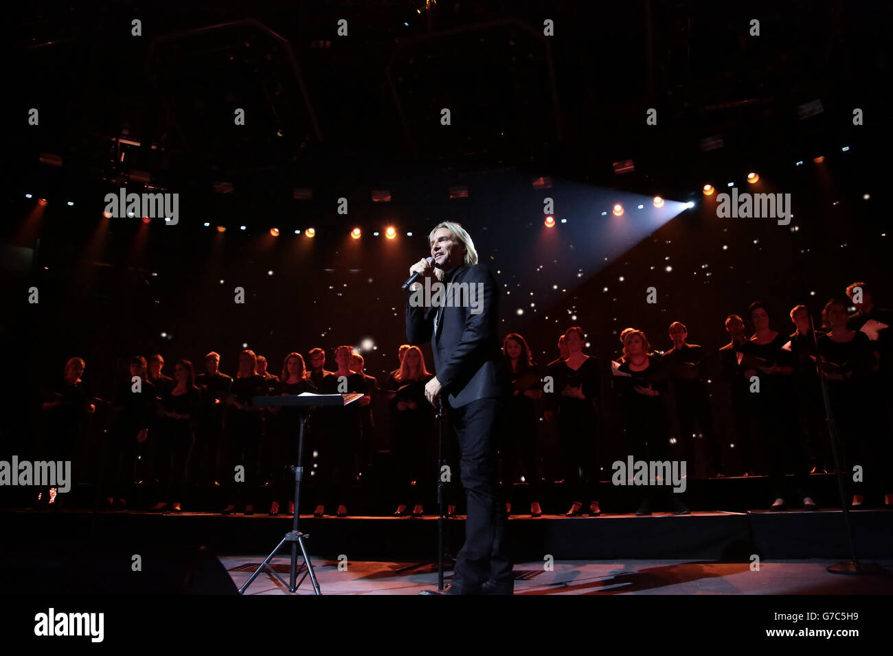 Eric Whitacre performing live on stage with the Eric Whitacre Singers ...
