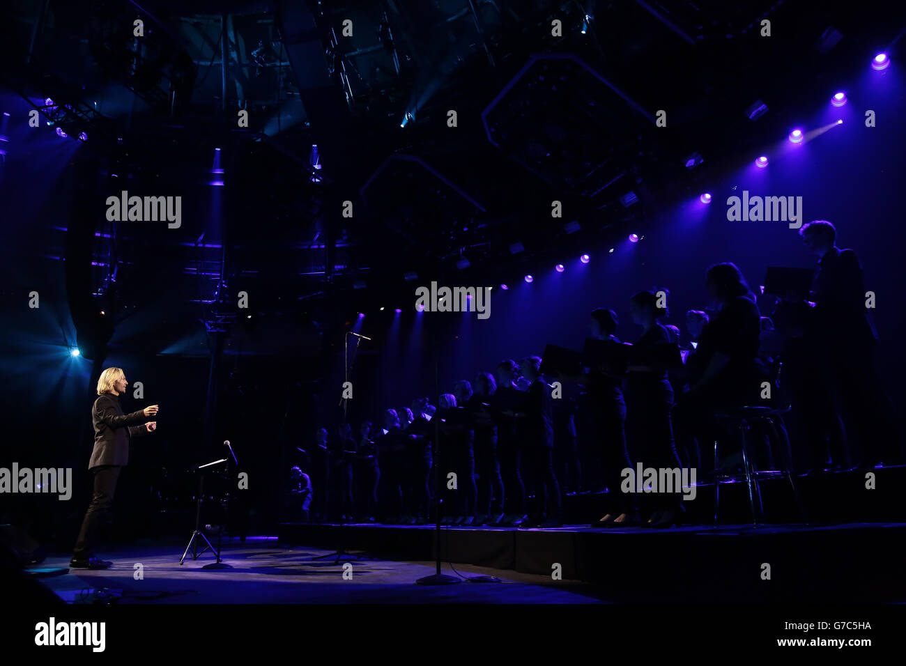 Eric Whitacre performing live on stage with the Eric Whitacre Singers ...