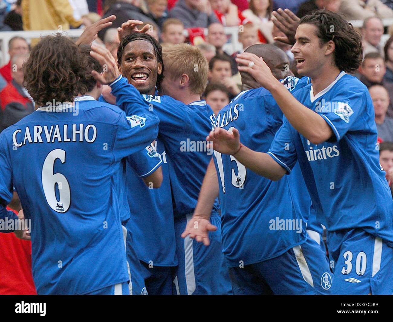 Didier Drogba of Chelsea (facing) is the centre of attention as Chelsea ...