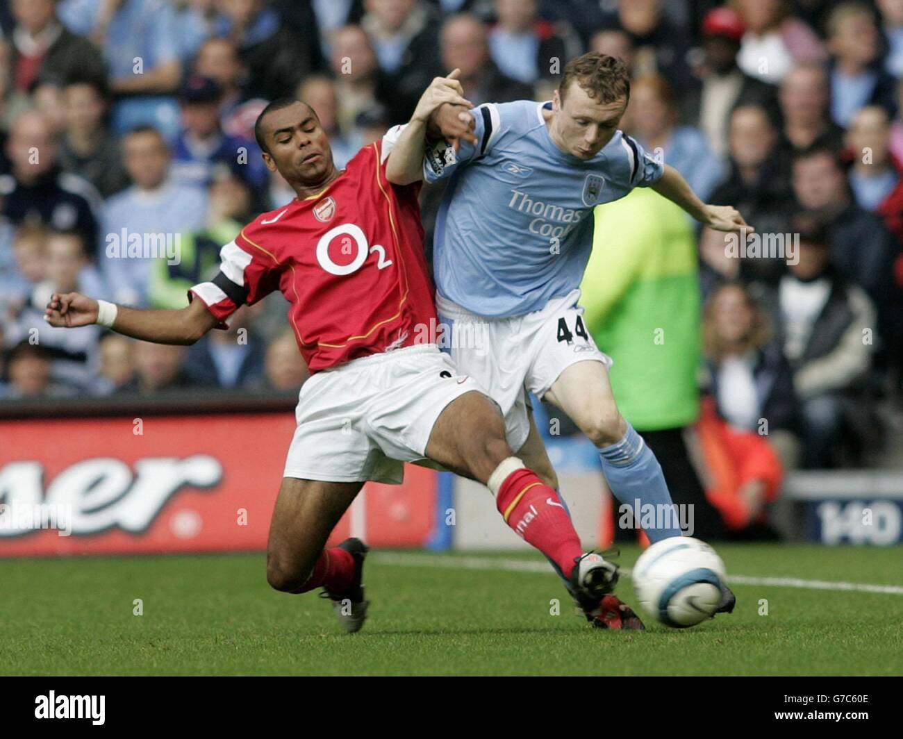 Manchester City's Willo Flood (right) challenges Arsenal's Ashley Cole ...