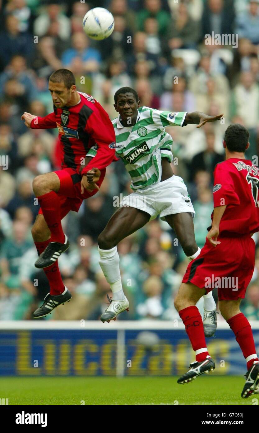 Dunfermline's Billy Mehmet contests a high ball with Celtic's Momo ...