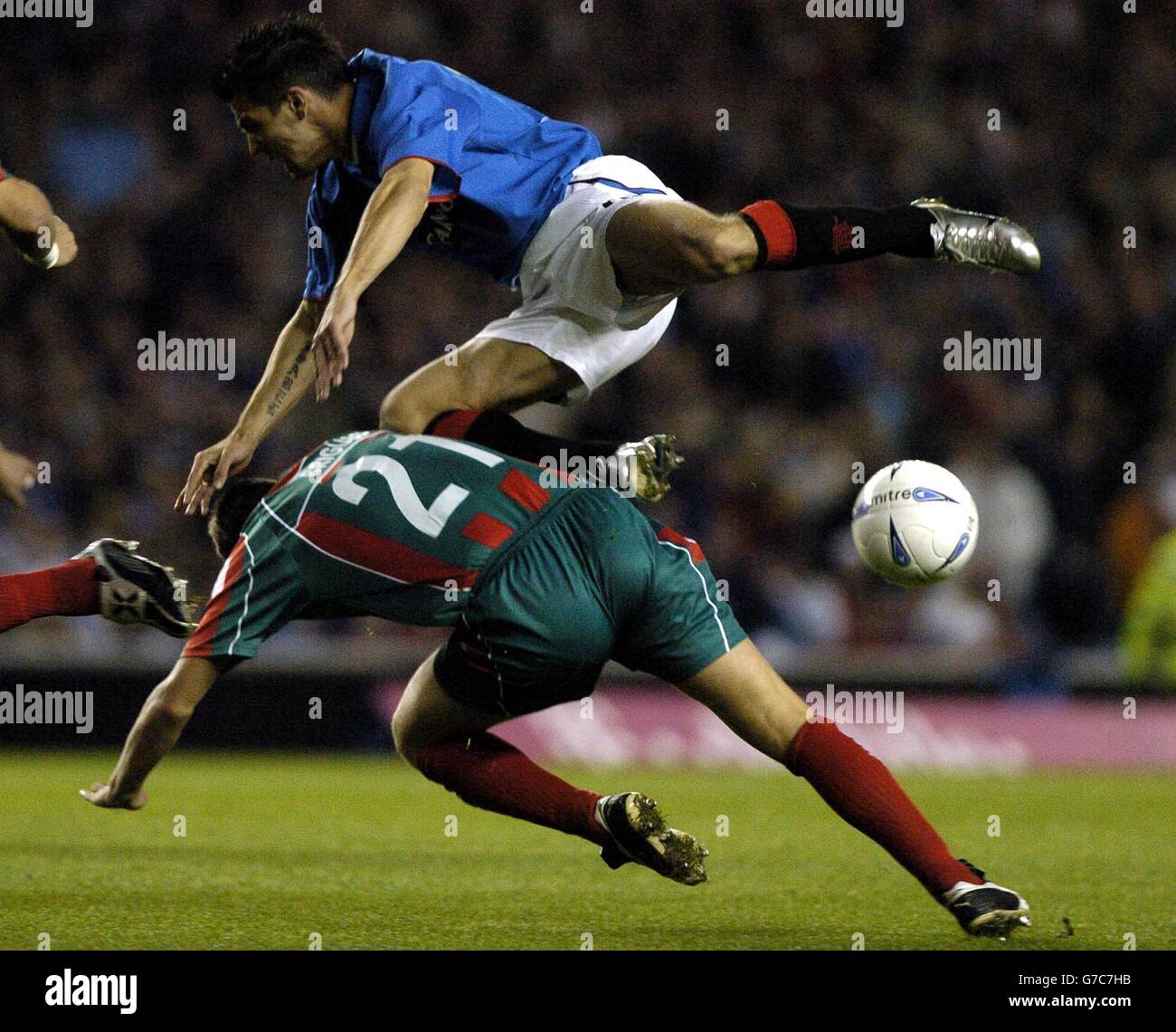 Rangers' Nacho Novo challenges Maritimo's Miguel Pereira during the ...