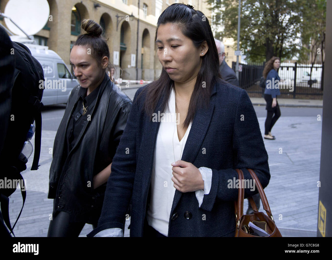 Julie Wong (right) leaves Southwark Crown Court in London after giving ...