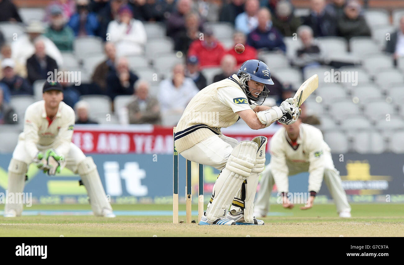 Middlesex batsman Chris Rogers avoids a bouncer from Lancashire bowler Junaid Khan, during day ...