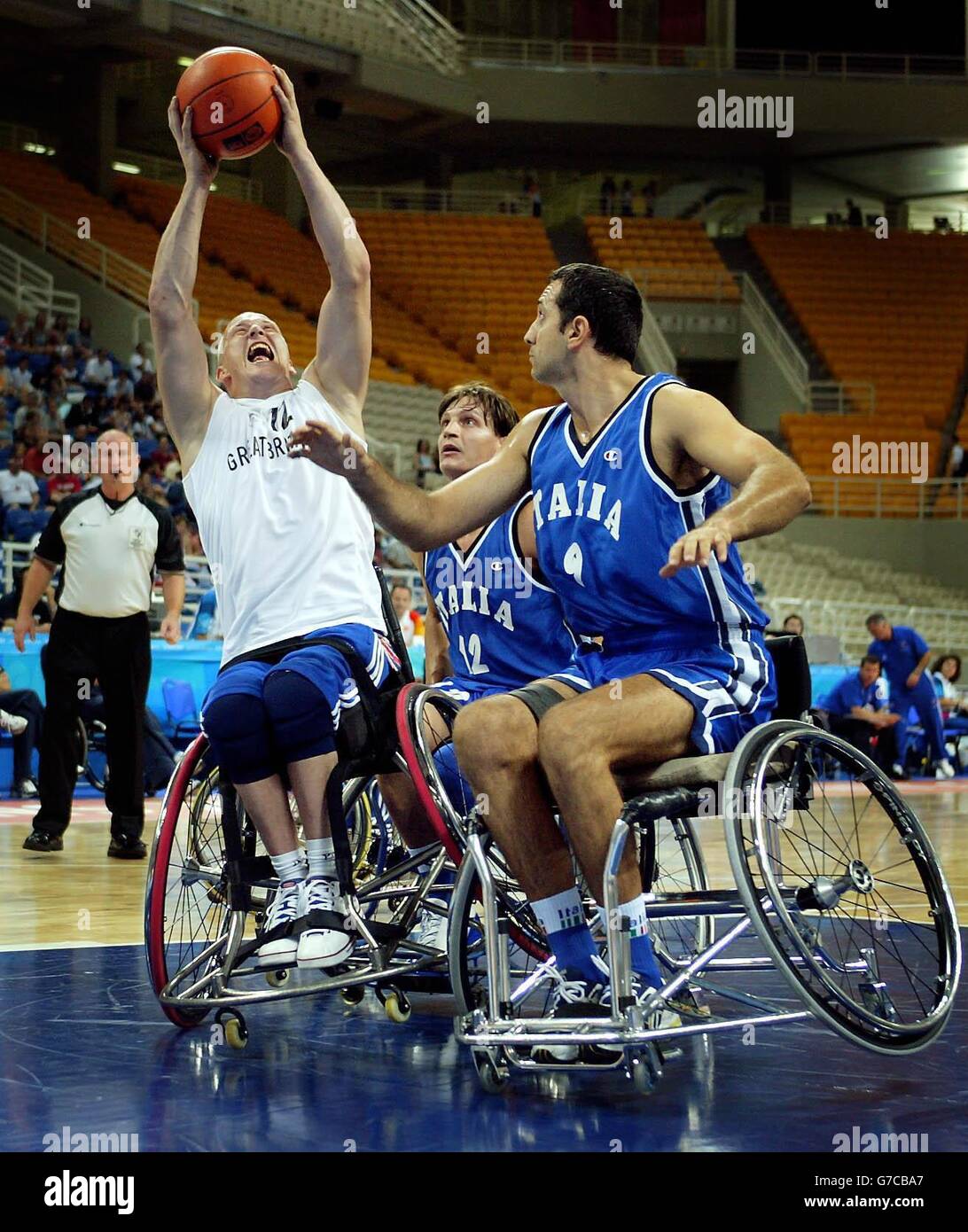 Great Britain's Andy Blake (left) tries to shoot past Italy's Sergio ...