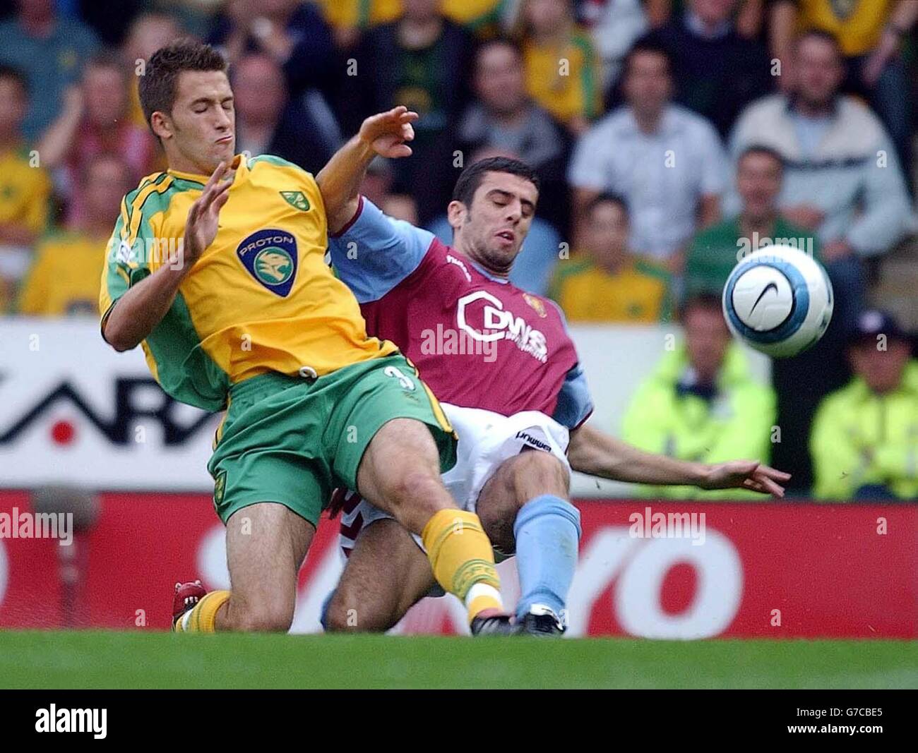 Norwich City's Adam Drury (L) tussles with Aston Villa's Mark Delaney ...