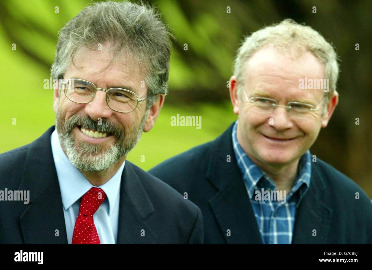Sinn Fein's Gerry Adams and Martin McGuinness (R) speaks to the media ...