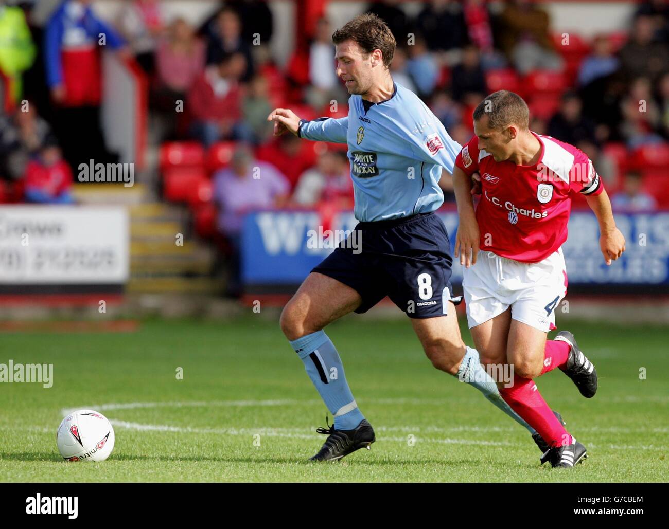 Crewe Alexandra's Kenny Lunt (R) challenges Leeds' Sean Gregan during ...