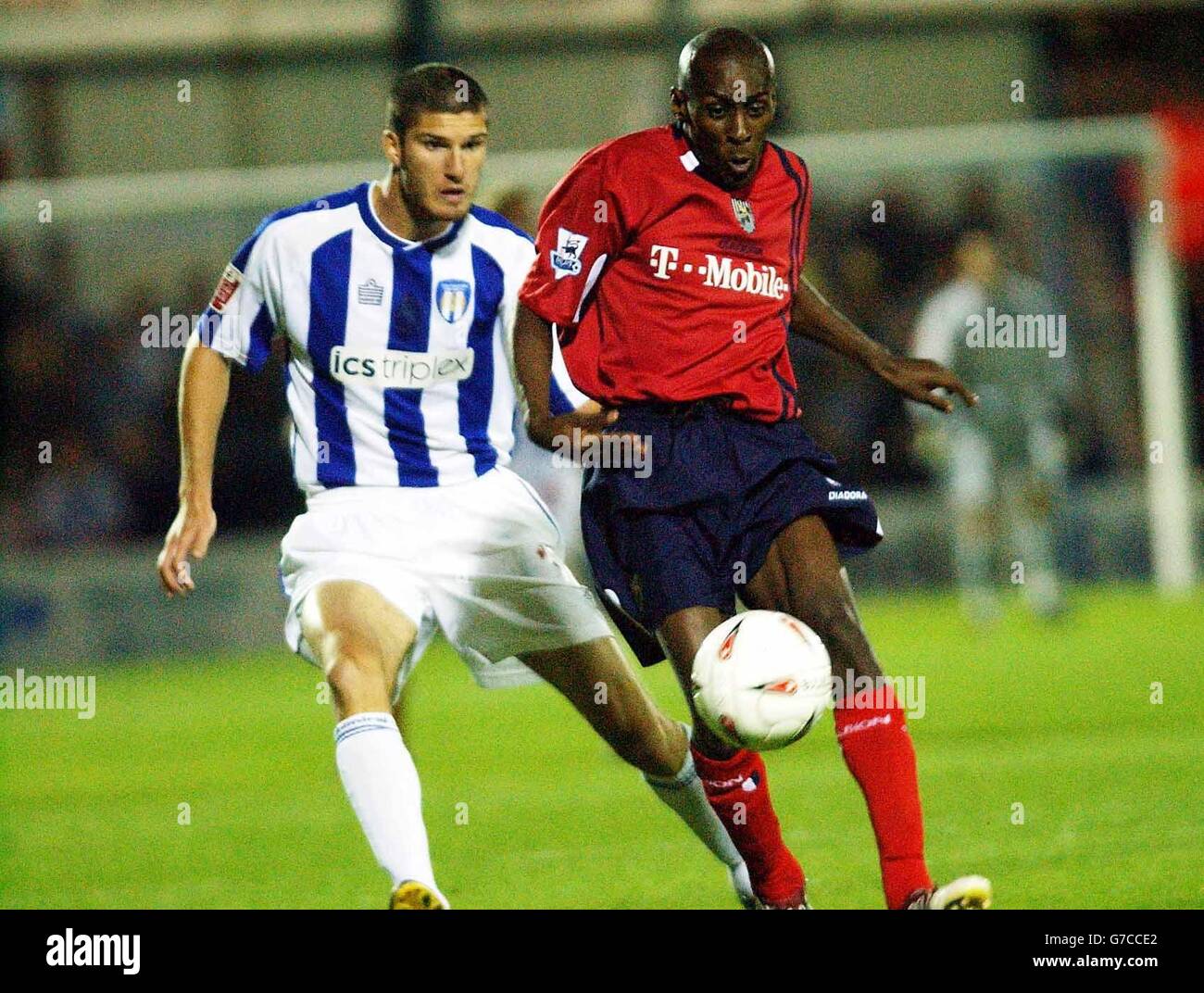 Colchester United's Pat Baldwin (left) tracks West Brom's Lloyd Dyer ...