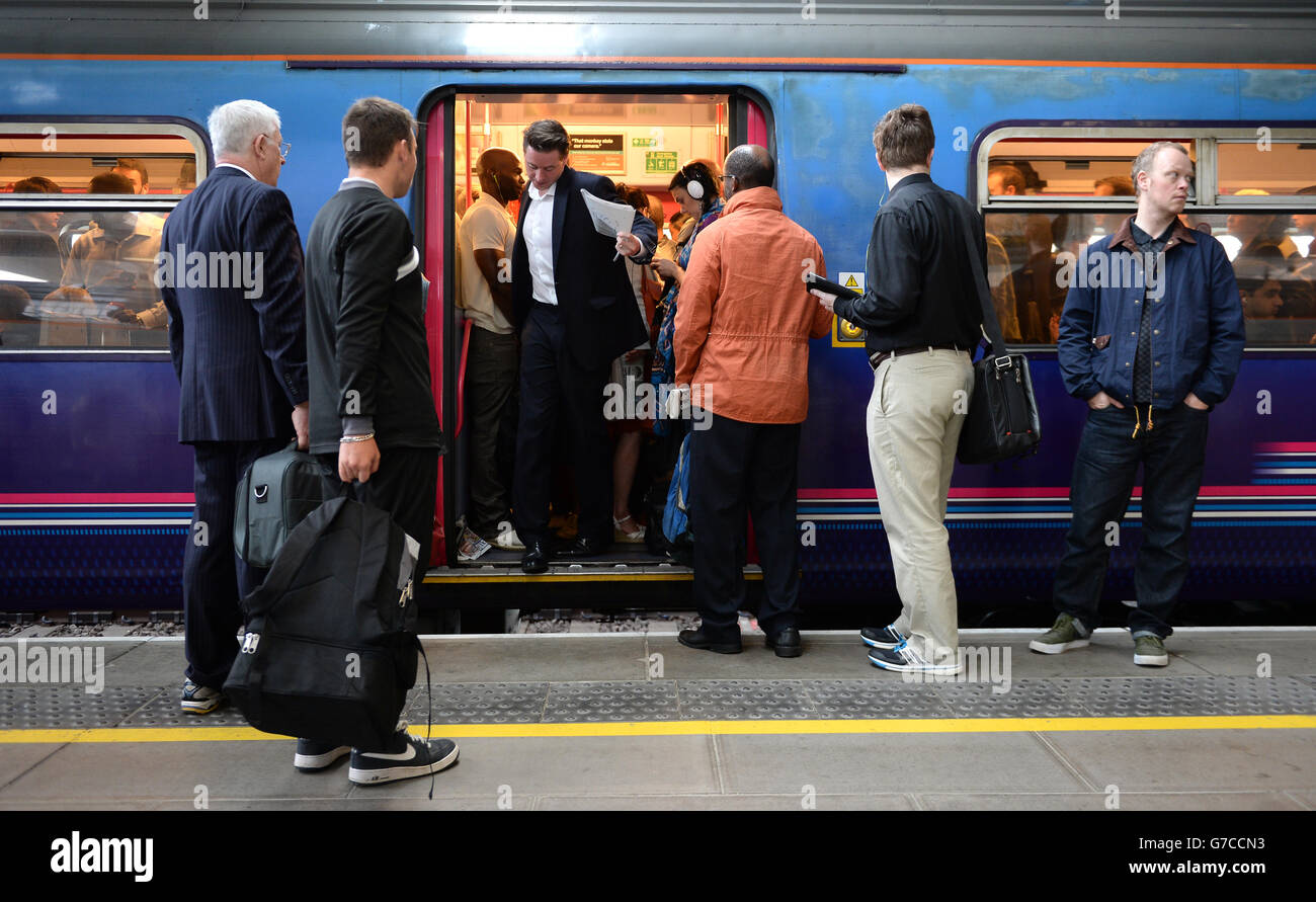 News rail commuter hi-res stock photography and images - Alamy