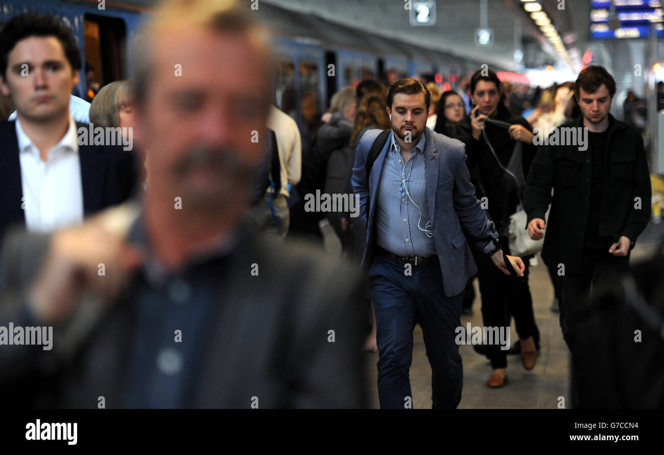 Commuter Stock. Commuters make their way across a platform at ...