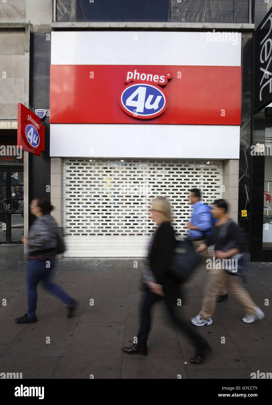 A Phones 4U shop in Oxford Street in central London with its shutters ...
