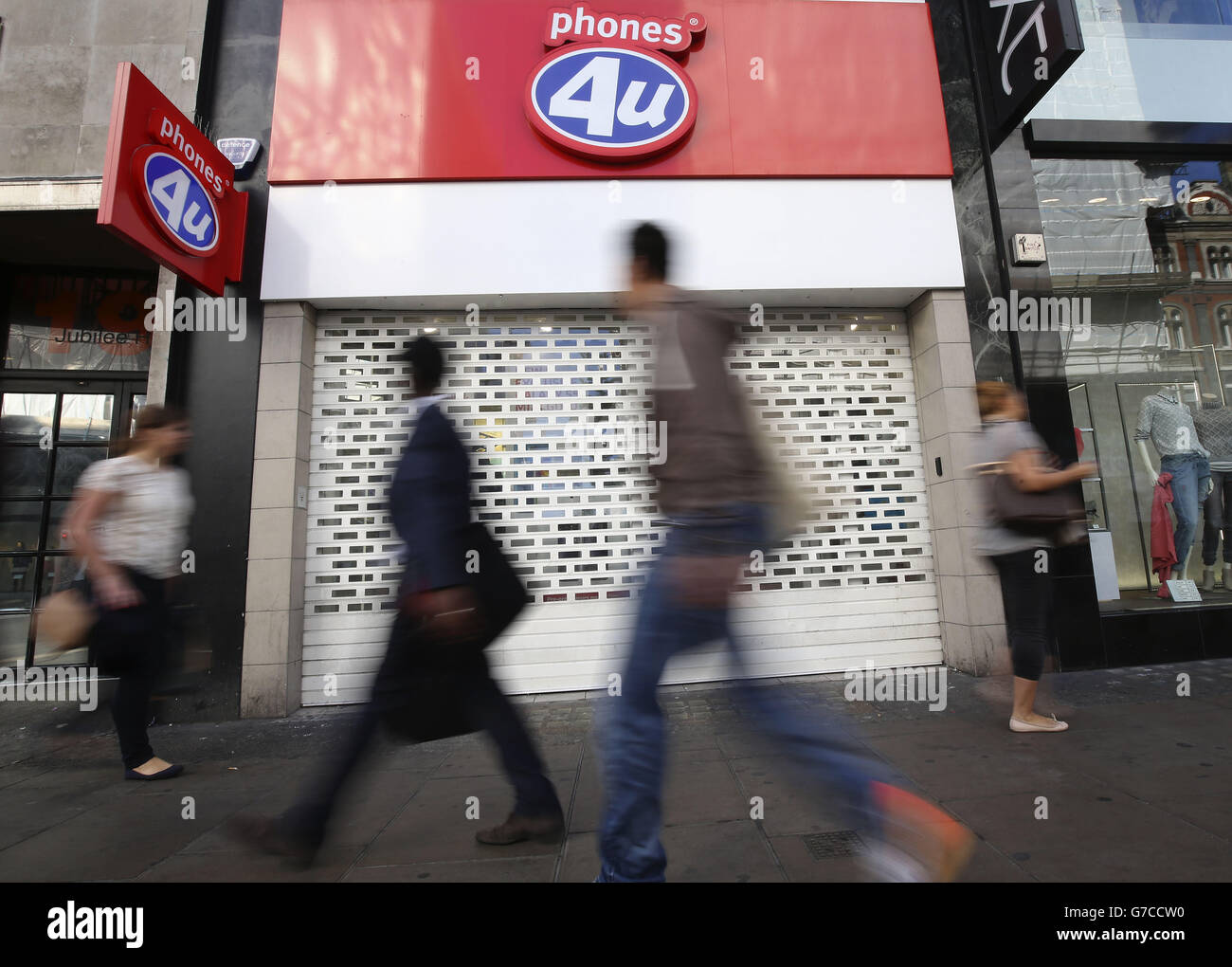 A Phones 4U shop in Oxford Street in central London with its shutters down as more than 500 of ...