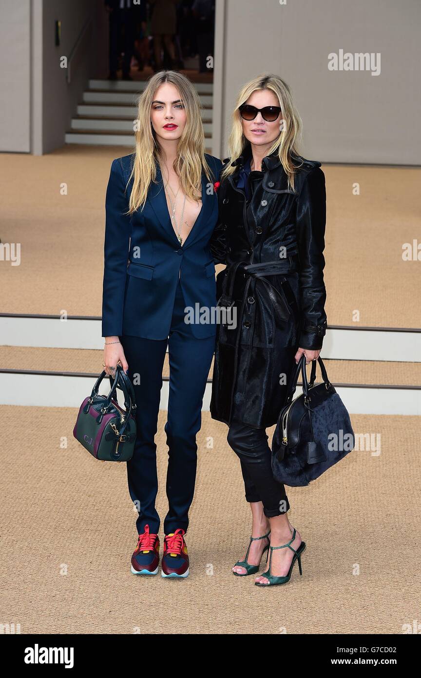 Cara Delevingne (left) and Kate Moss arriving for the Burberry Prorsum ...