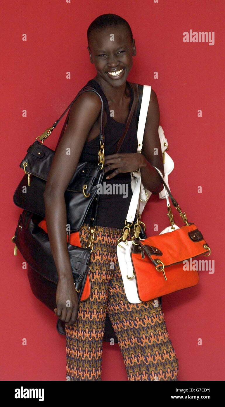 London fashion Week - Alek Wek couture handbags Stock Photo - Alamy