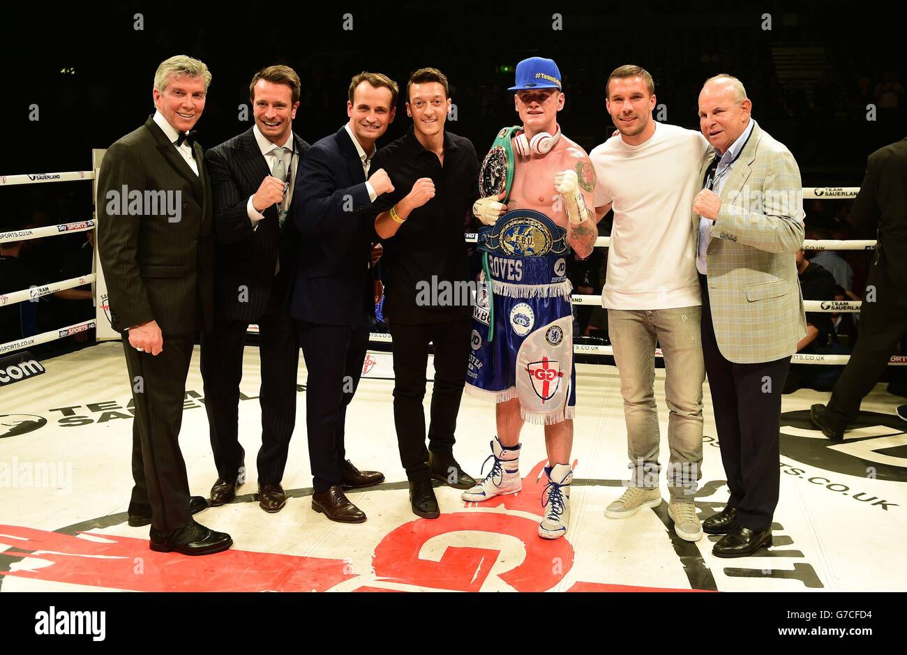 UK's George Groves (centre) celebrates defeating France's Christopher ...