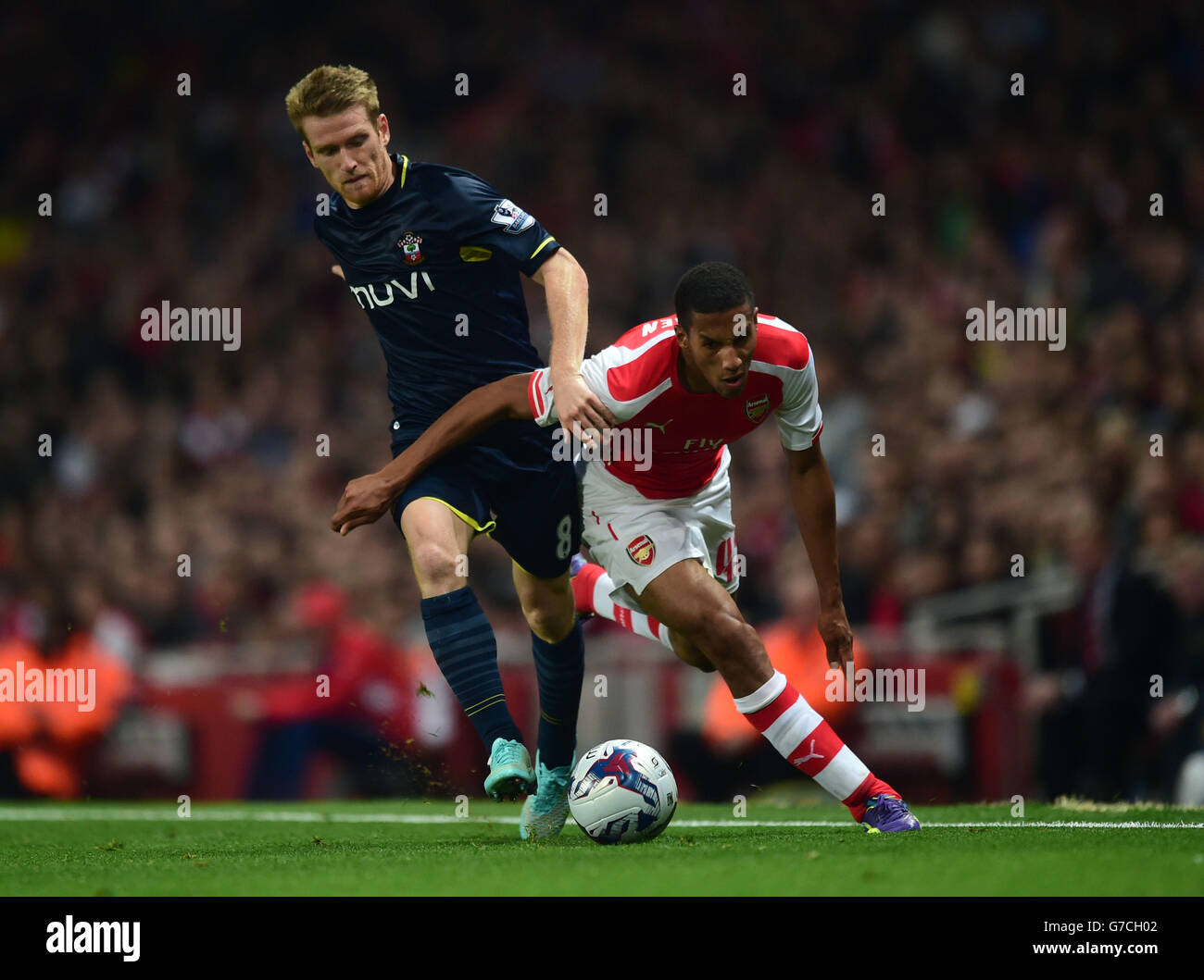 Arsenal's Isaac Hayden and Southampton's Steven Davis battle for the ...