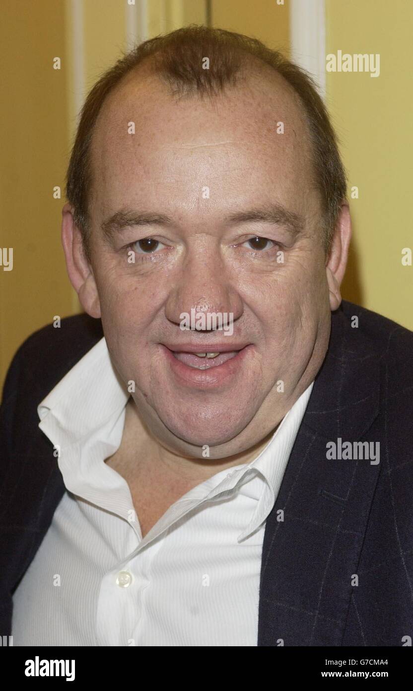 Actor, comedian and director Mel Smith poses for photographers as he ...