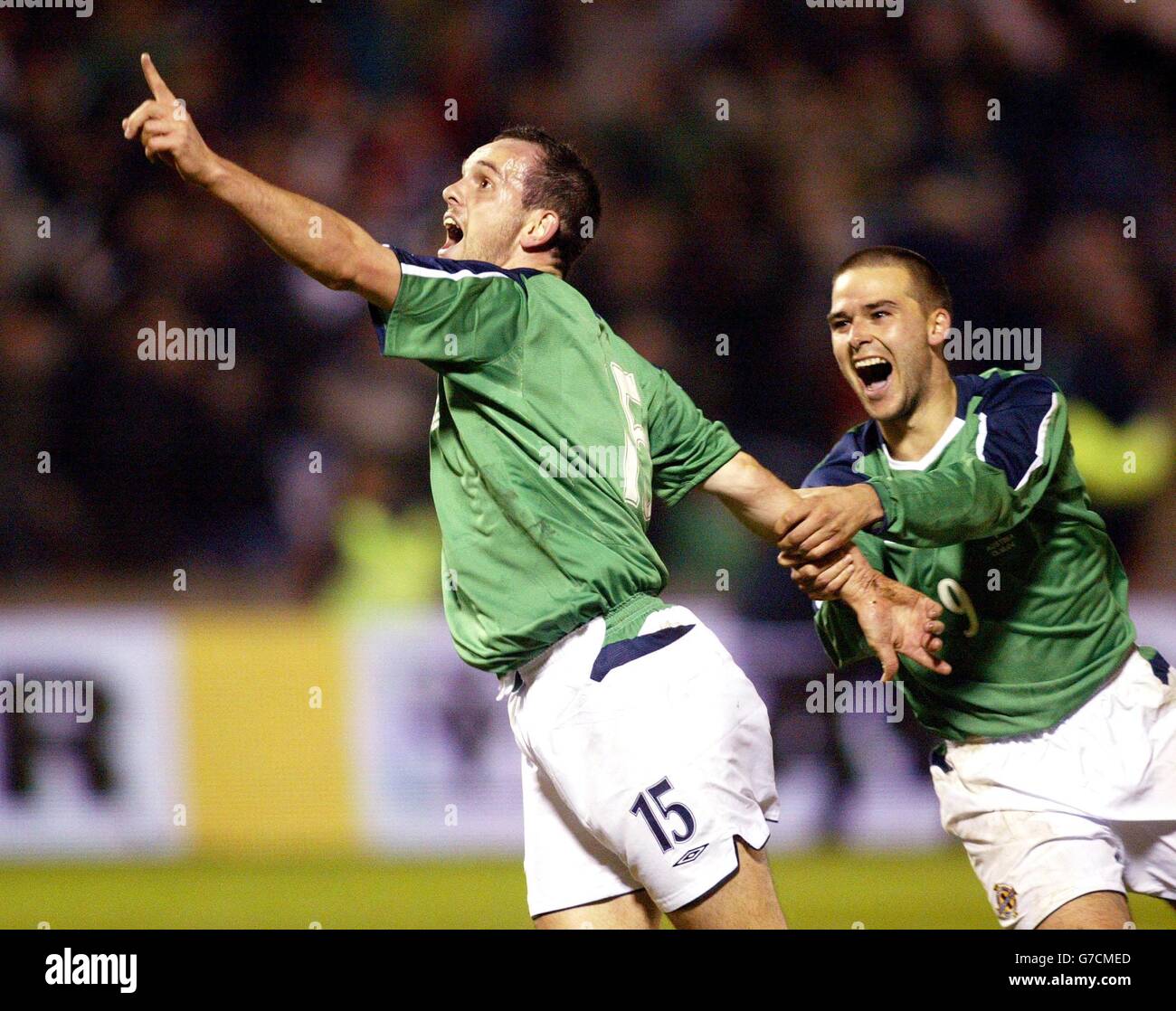 Northern Ireland's Stuart Elliott (left) celebrates scoring the last ...