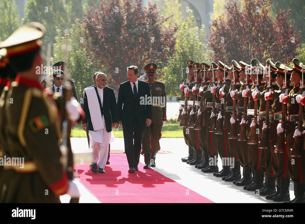 Prime Minister David Cameron is welcomed to the Presidential Palace by ...