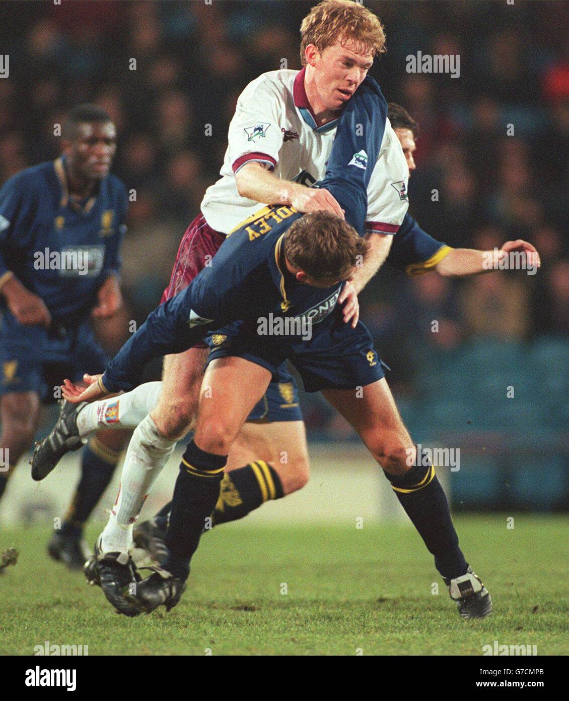 Aston Villa's Steve Staunton climbs all over Wimbledon's Neil Ardley ...