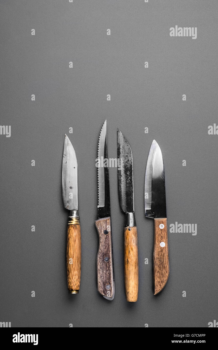 collection of various kitchen knives on a grey background Stock Photo ...