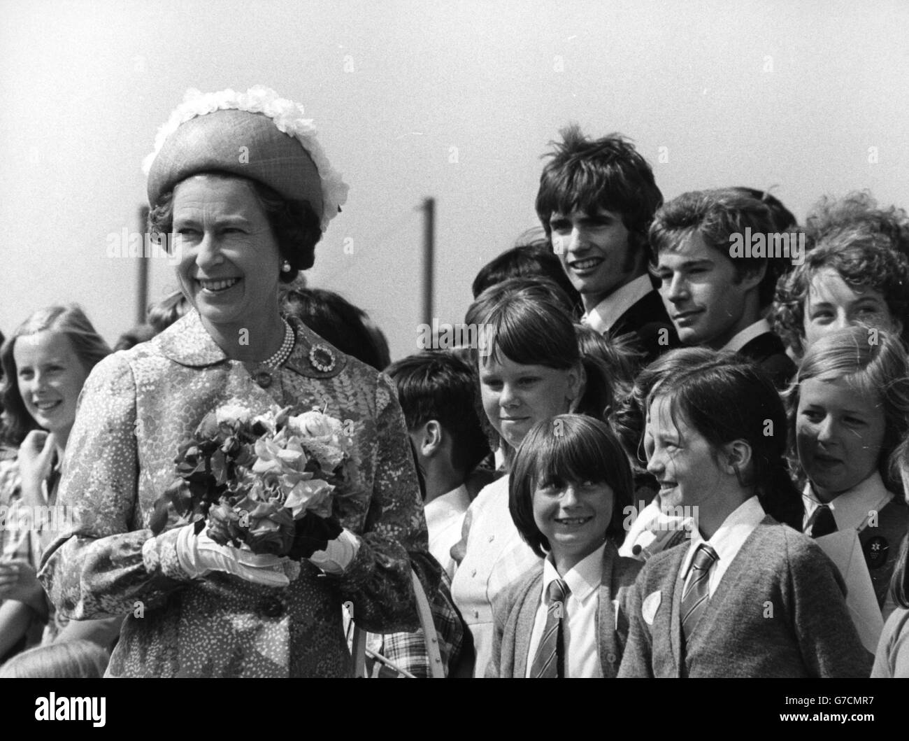 Queen Elizabeth II meets a group of young people during her walkabout ...