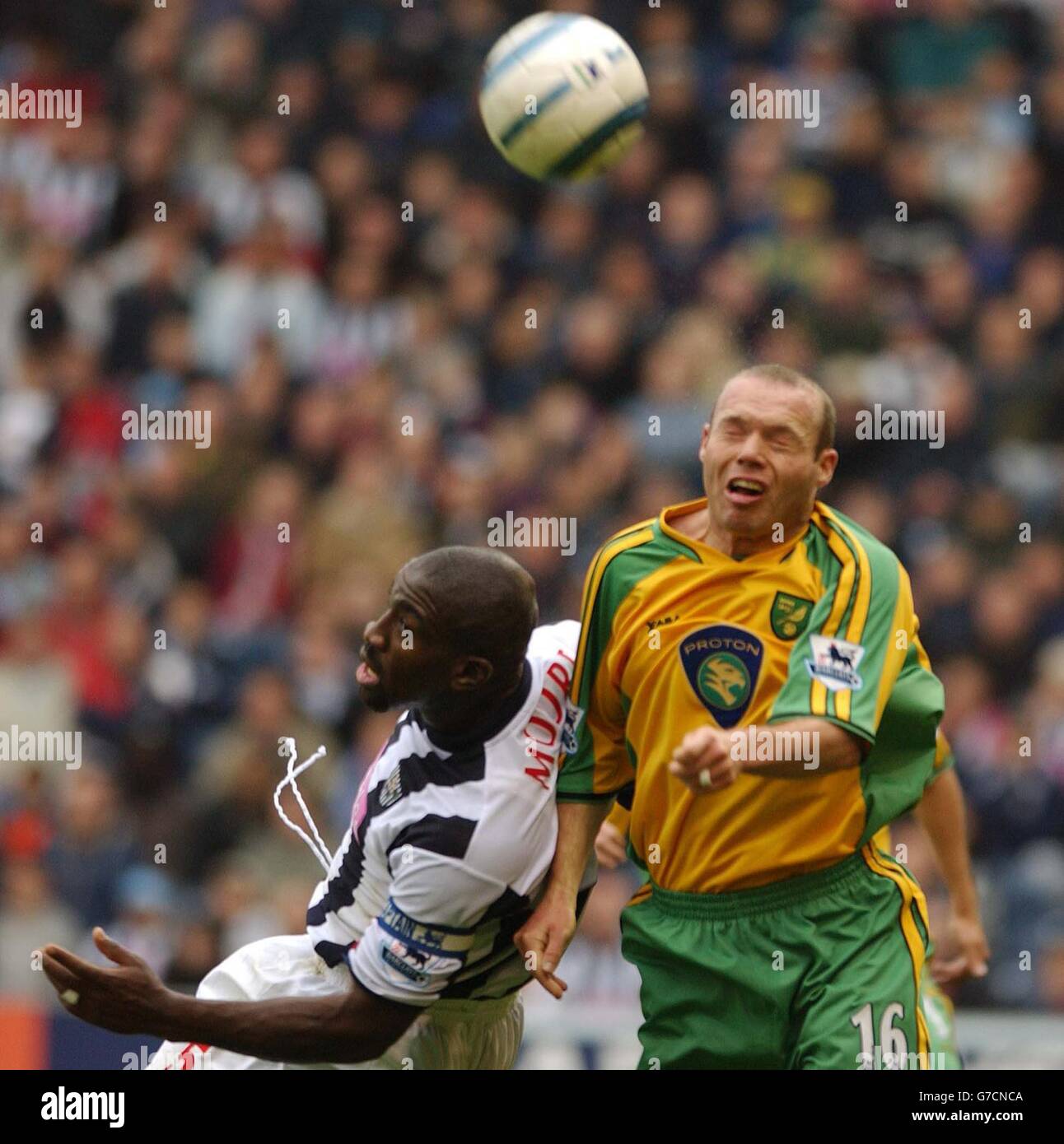 Norwich defender Simon Charlton heads clear from West Bromwich Albion's ...