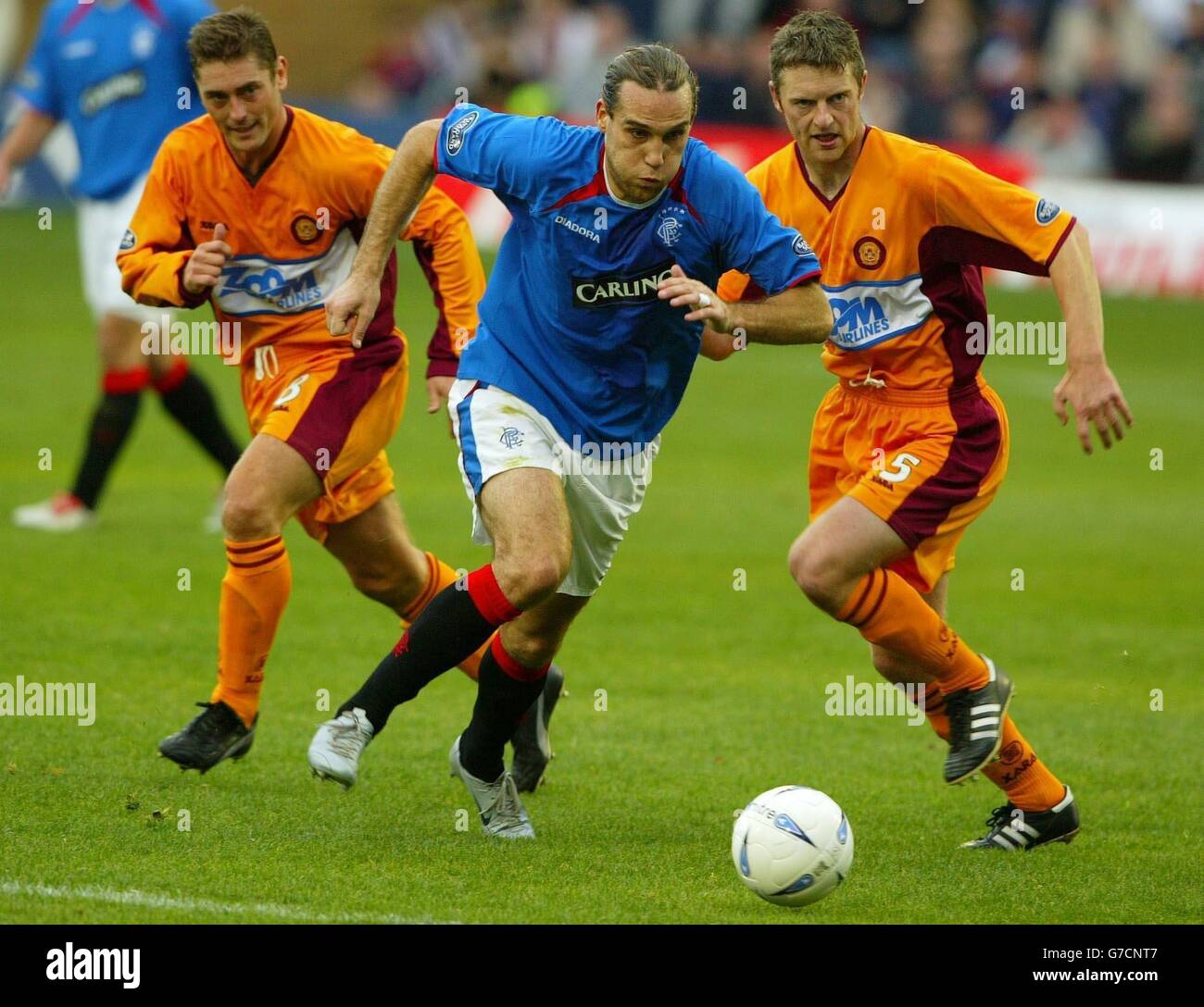 Ranger's Dado Prso moves past Motherwell's Steven Hammell and Scott ...