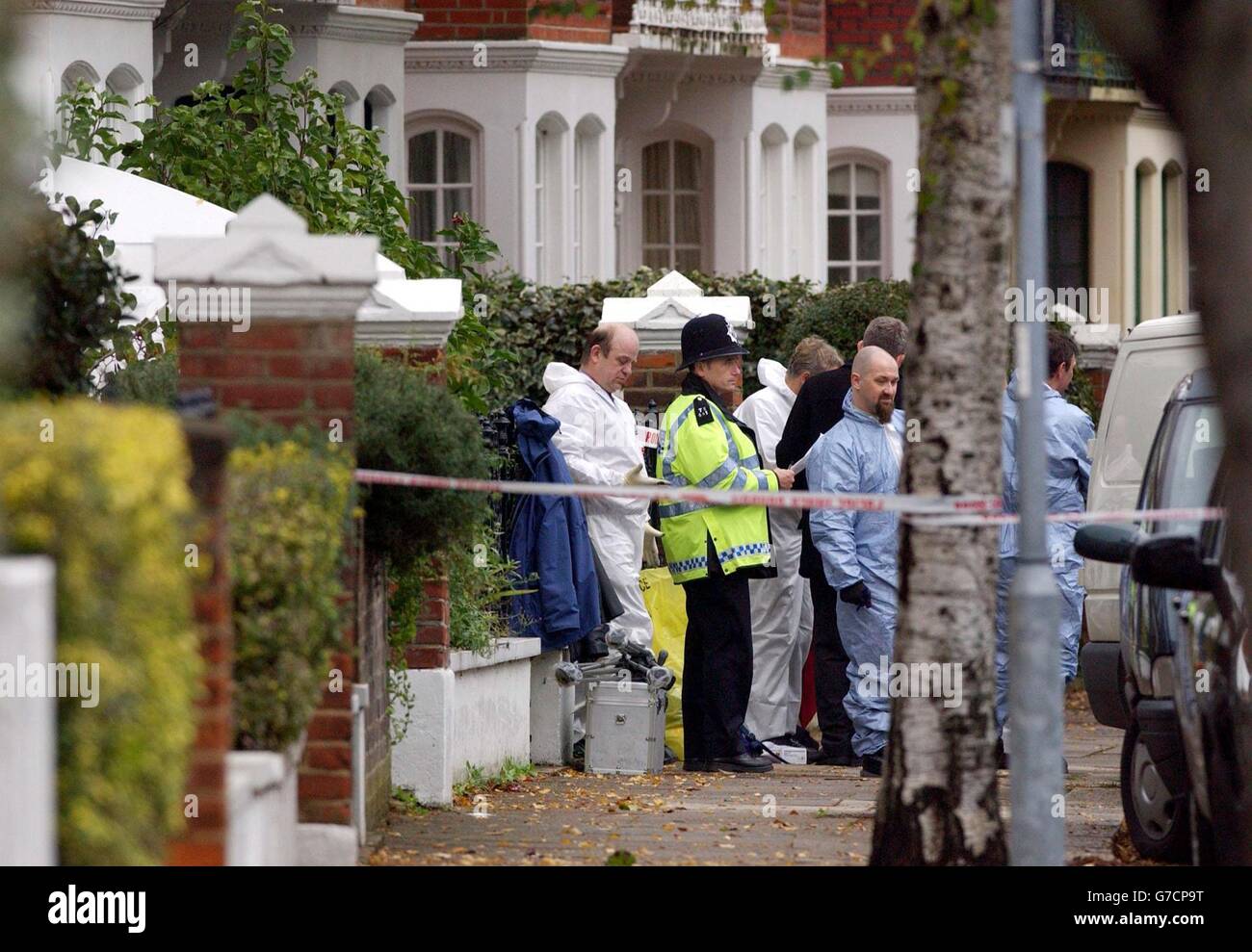 Police forensic teams outside the house in Chiswick, London where a ...