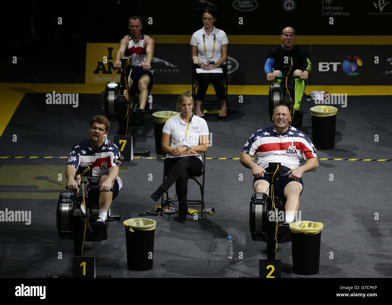 Competitors in an endurance 4 minute indoor rowing race hi-res stock ...