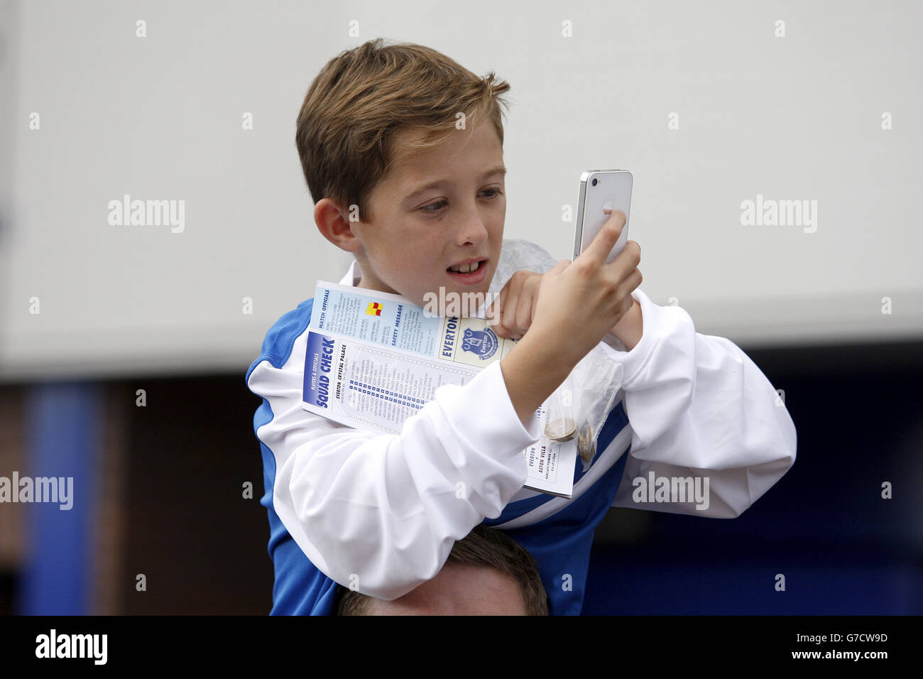 An Everton fan waits for the players to sign autographs Stock Photo - Alamy