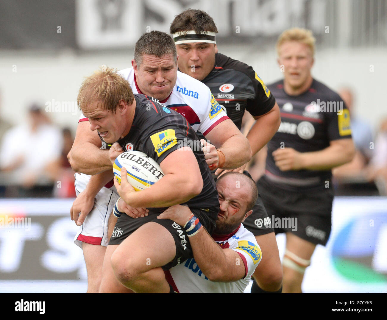Saracens' Rhys Gill is tackled by Sale Sharks' Eifion Lewis Roberts ...