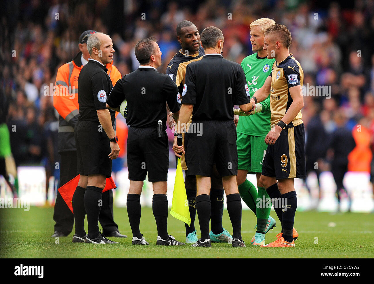 Leicester City's Kasper Schmeichel speaks with referee Keith Stroud ...