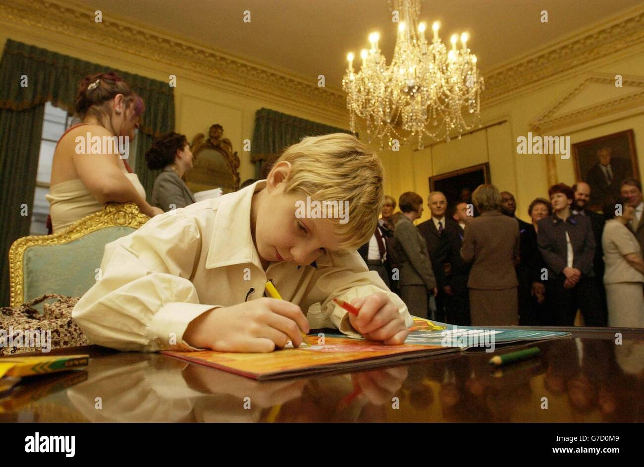 Aaron Gray from Peebles in Scotland concentrates on his colouring book ...