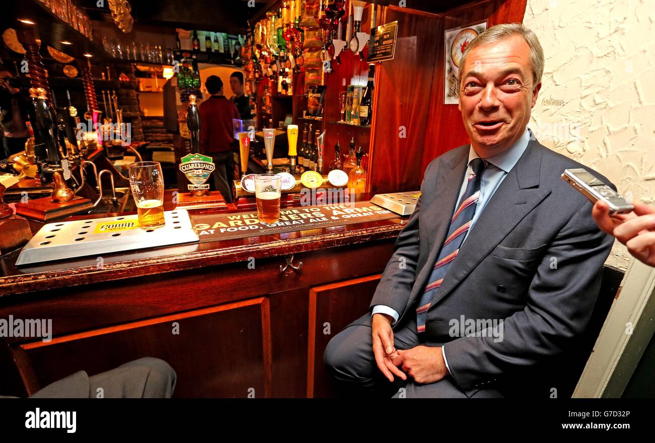 Ukip leader Nigel Farage enjoys a pint whilst campaigning ahead of the ...