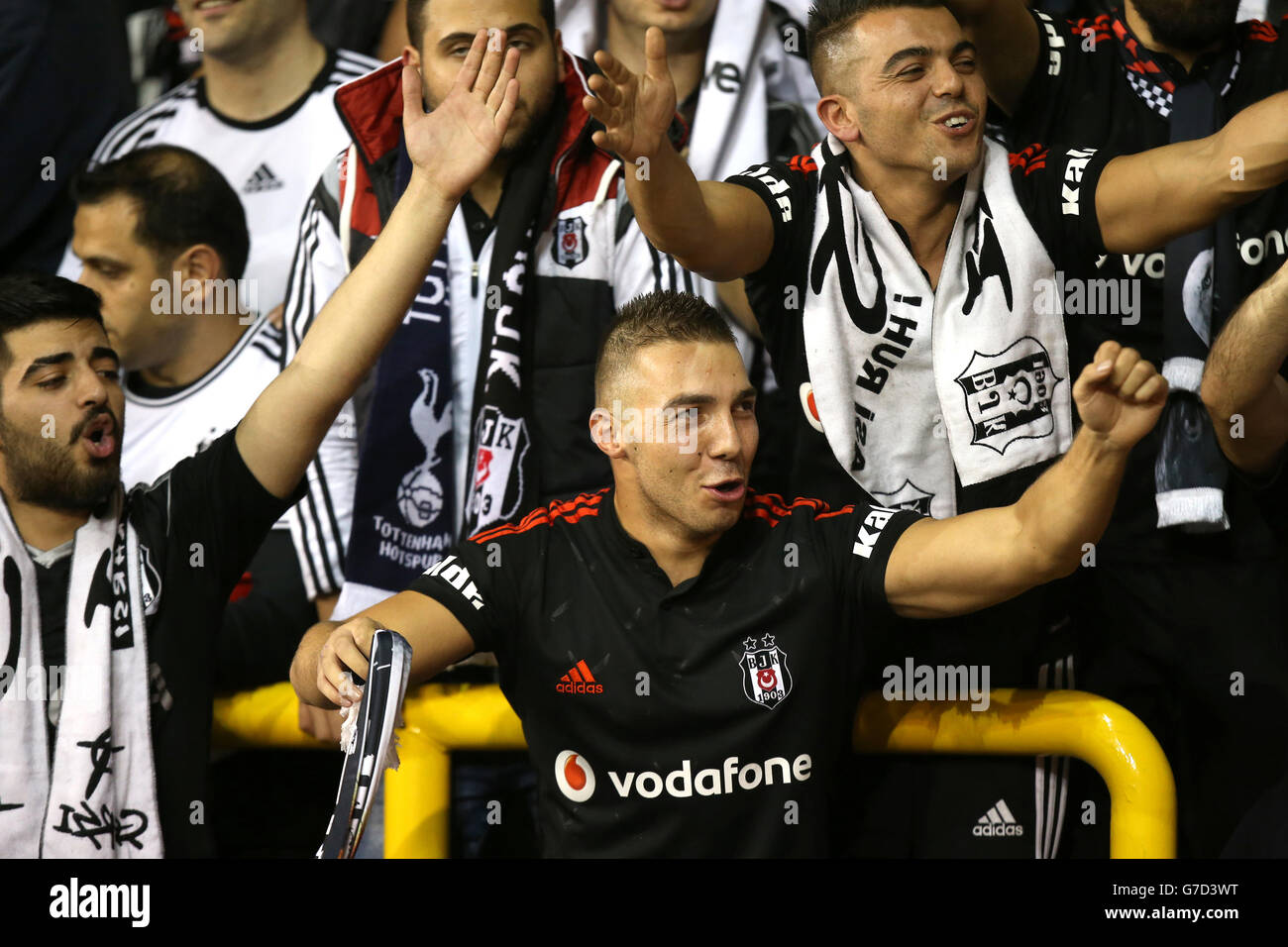 Tottenham hotspur fans cheer on their side in the stands hi-res stock ...