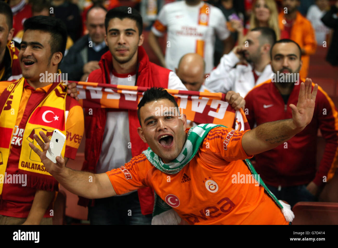 Galatasaray fans in the stands at the emirates stadium hi-res stock ...