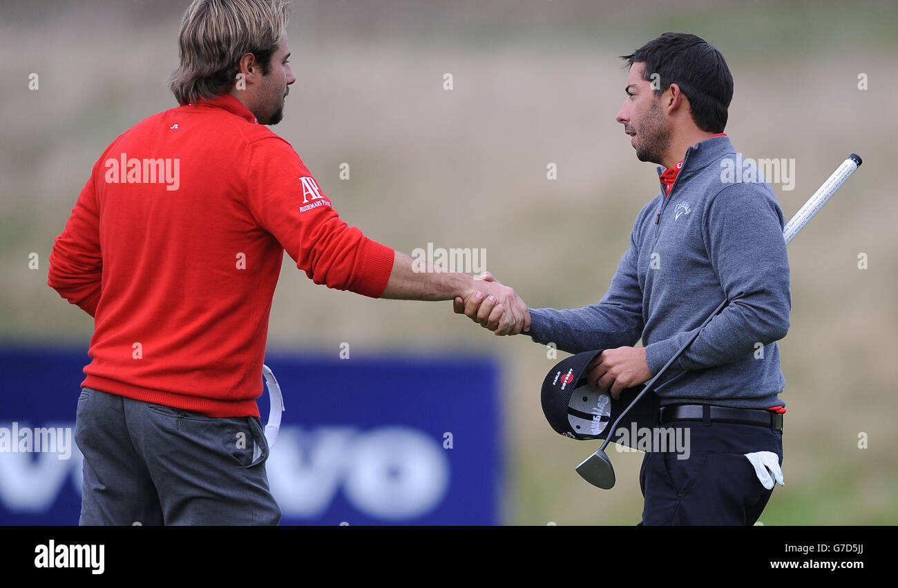 France's Victor Dubuisson (left) shakes hands with Spain's Pablo ...
