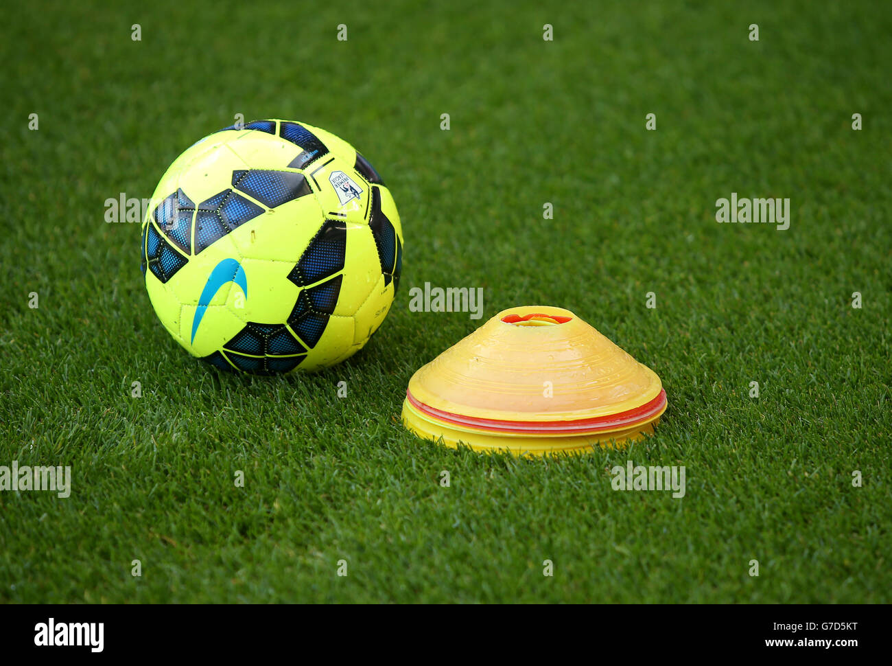 Detail view of cones and a Nike football on the pitch Stock Photo - Alamy