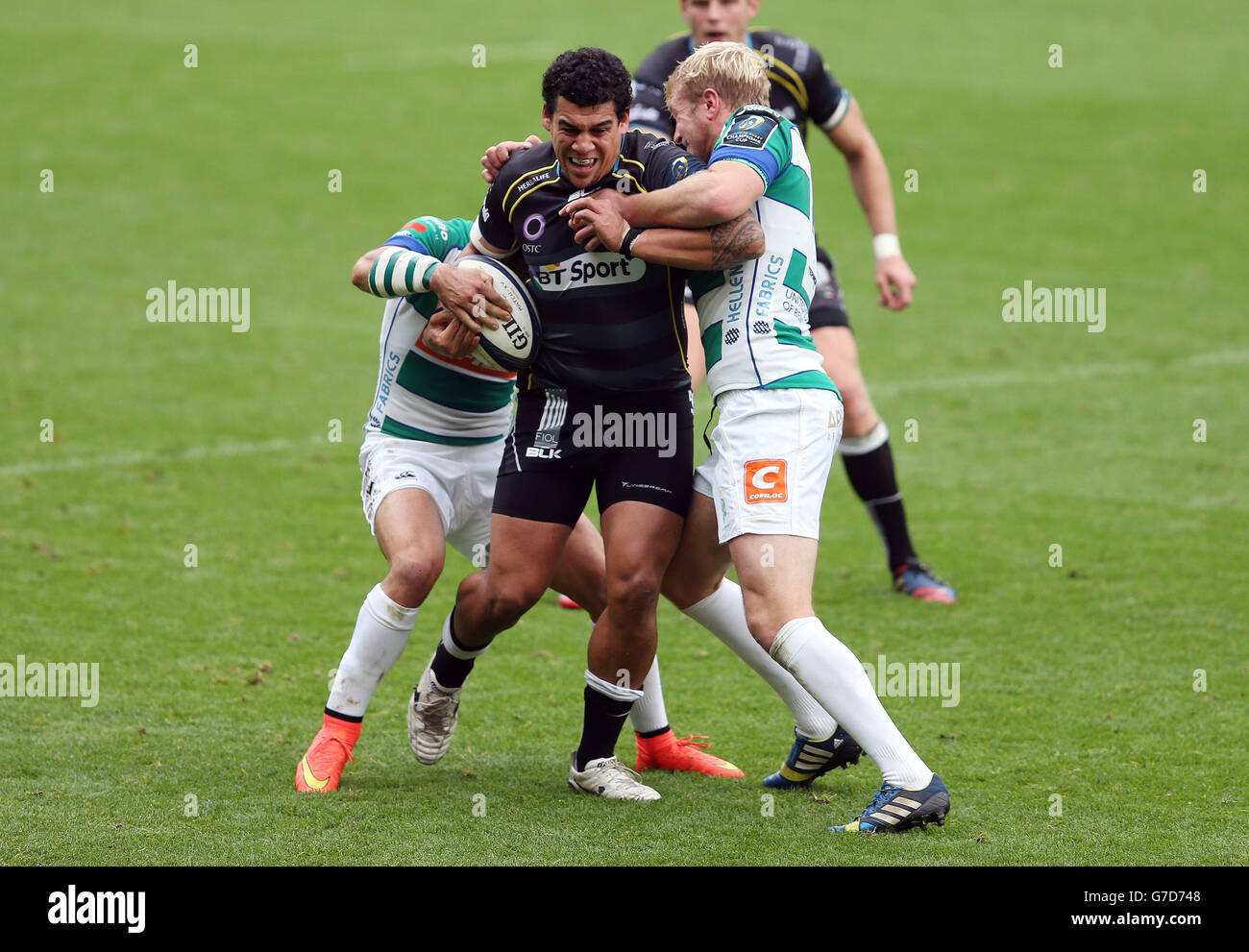 Ospreys' Josh Matavesi (centre) is tackled by Treviso's Alberto ...