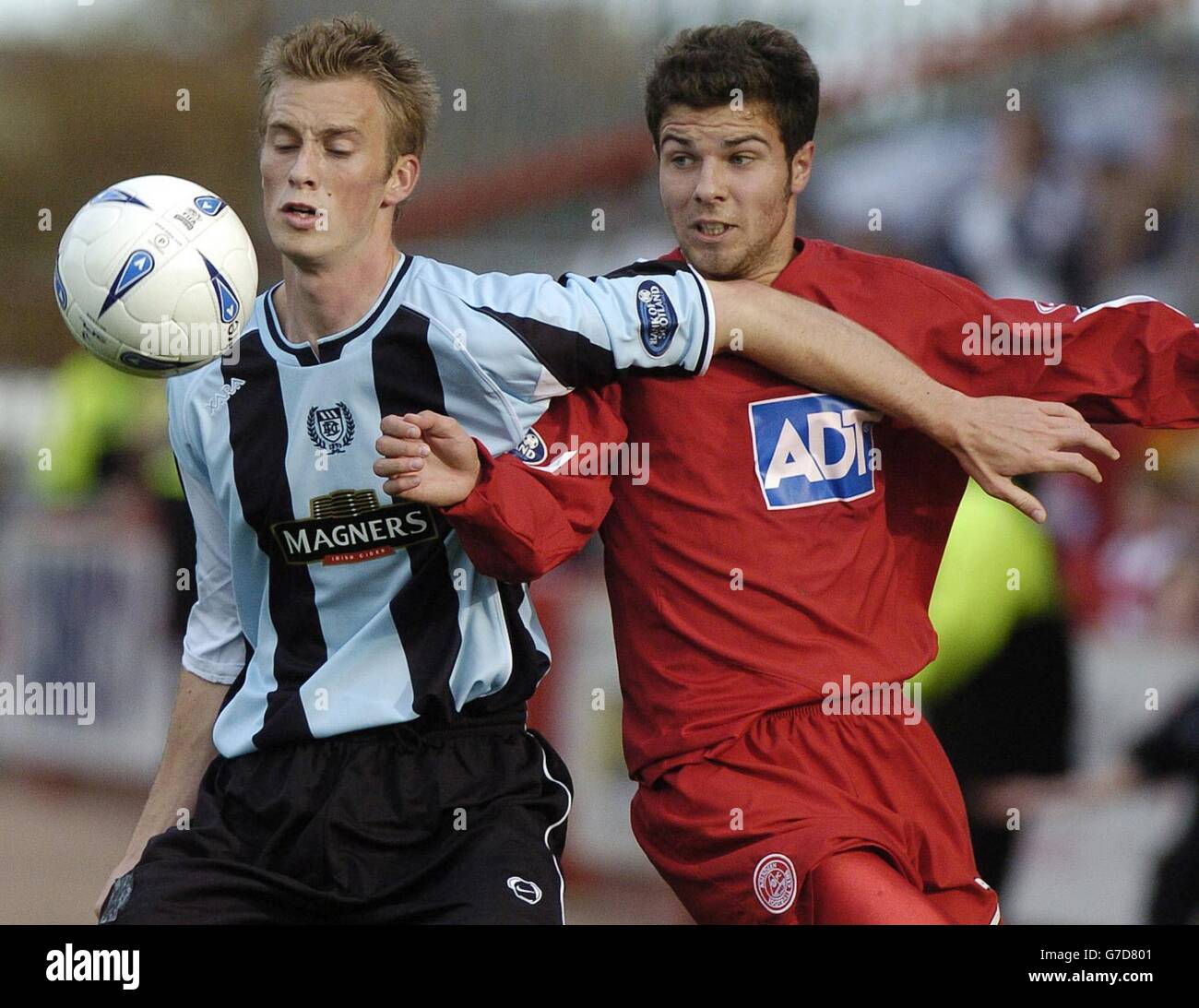 Aberdeen's Richard Foster (right) challenges Dundee's Neil Barrett ...