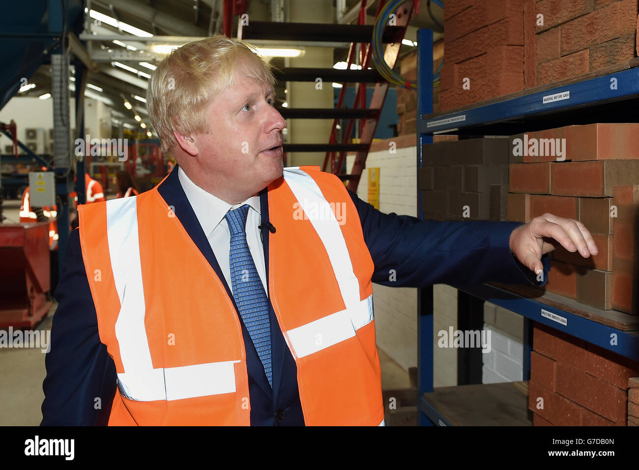Mayor of London Boris Johnson views an assortment of bricks during a ...