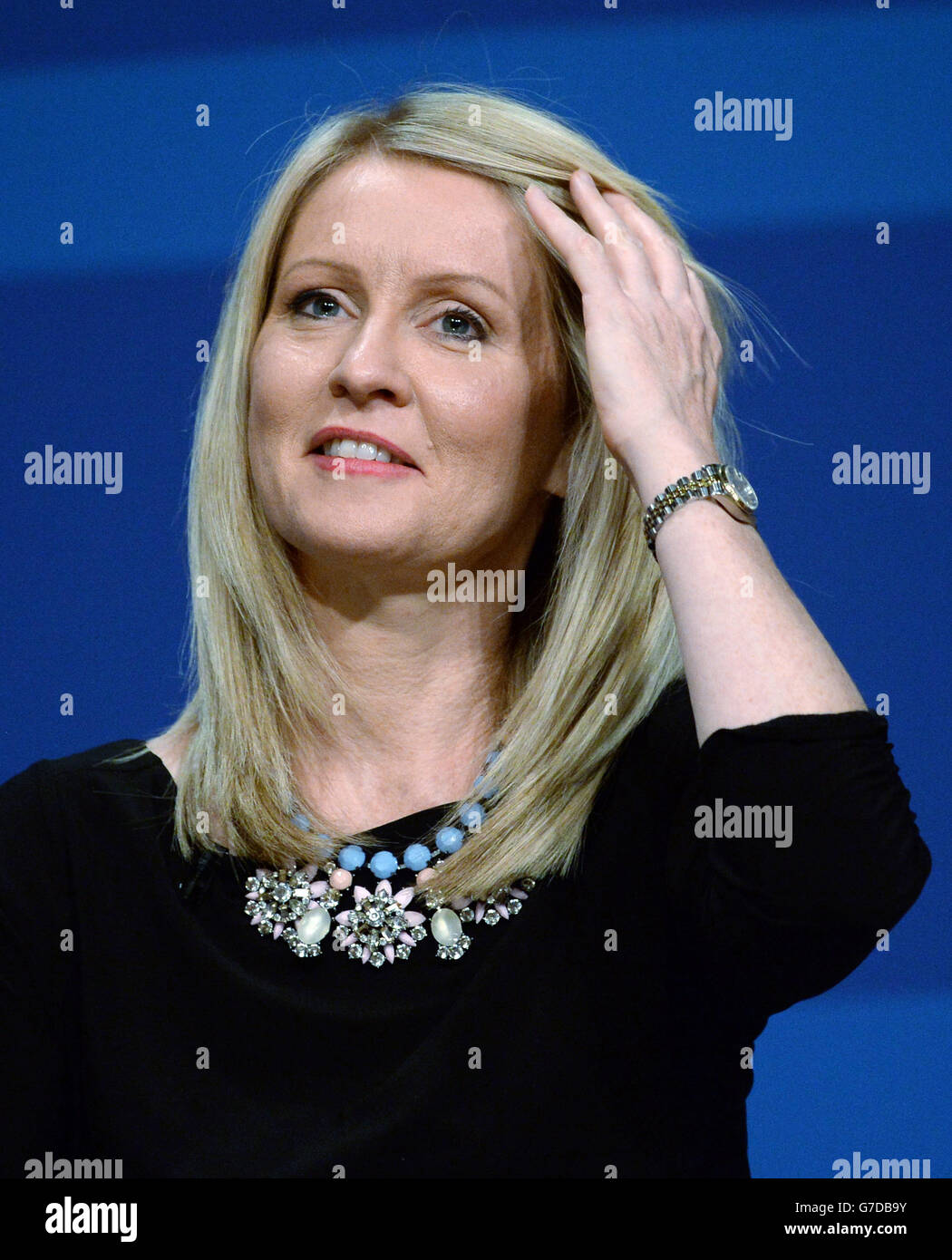 Employment Minister Esther McVey seated with special guests on stage at ...
